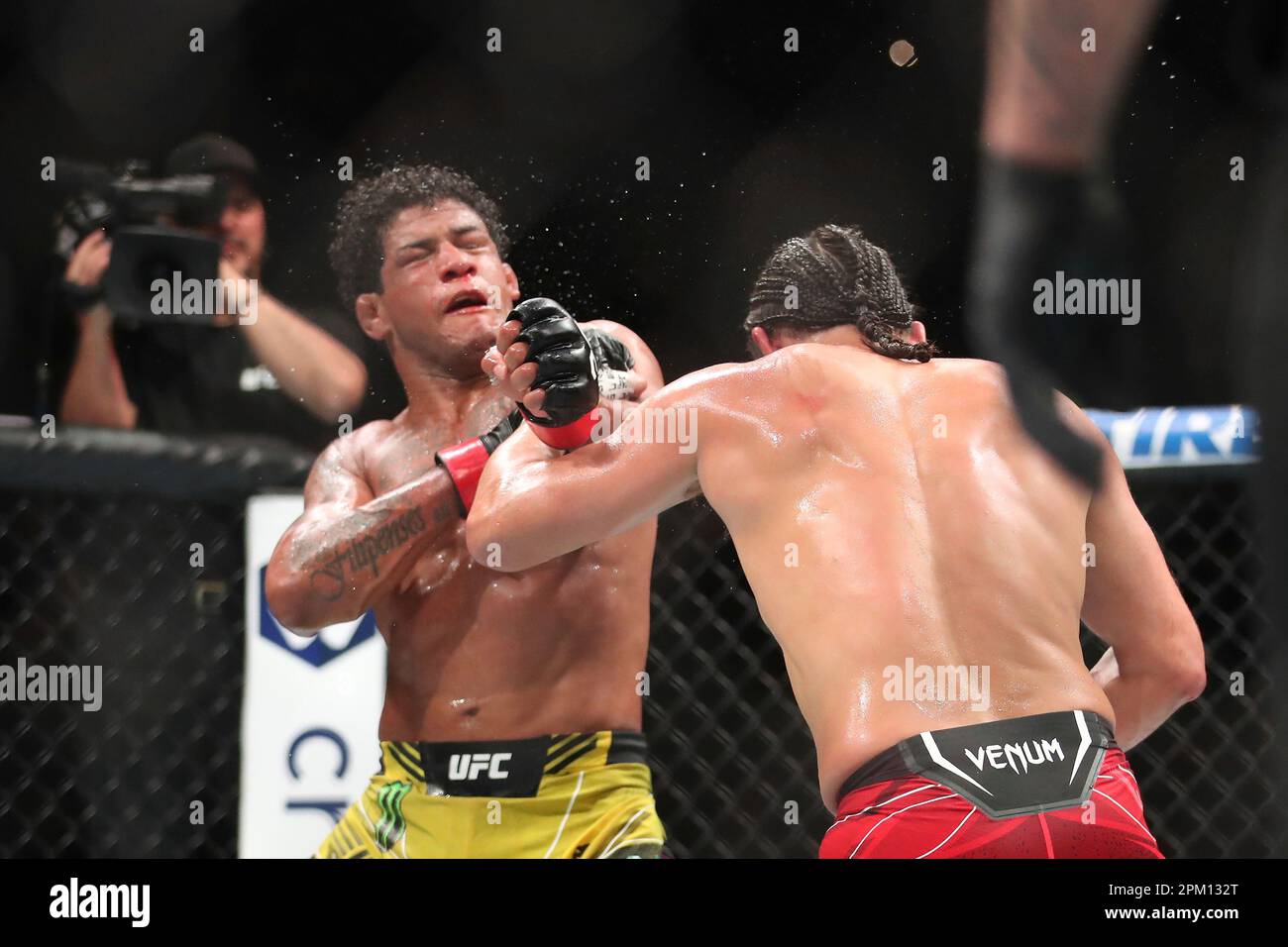 MIAMI, FLORIDA - APRIL 8: (R-L) Jorge Masvidal punches Gilbert Burns in ...