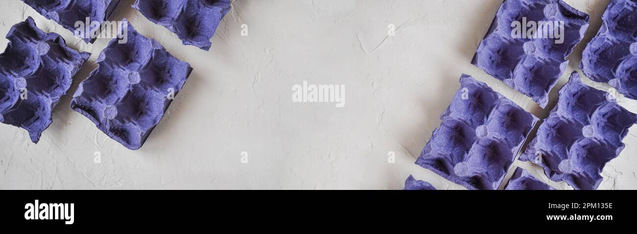 Top view of empty egg cartons, of blue-purple colors, to recycle, on ...