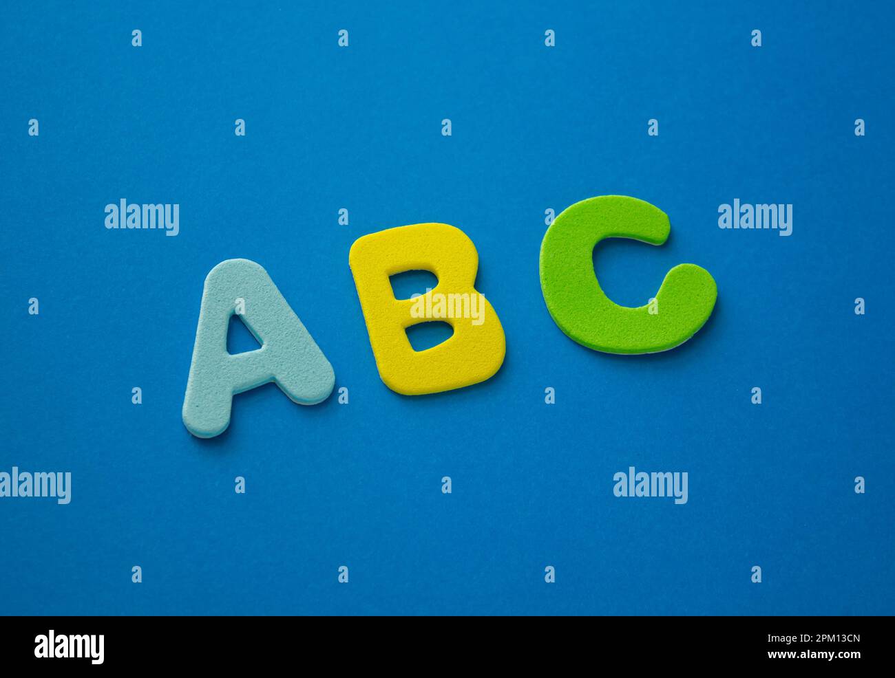 Green, Blue, yellow ABC letters alphabet on blue background. Learn ...