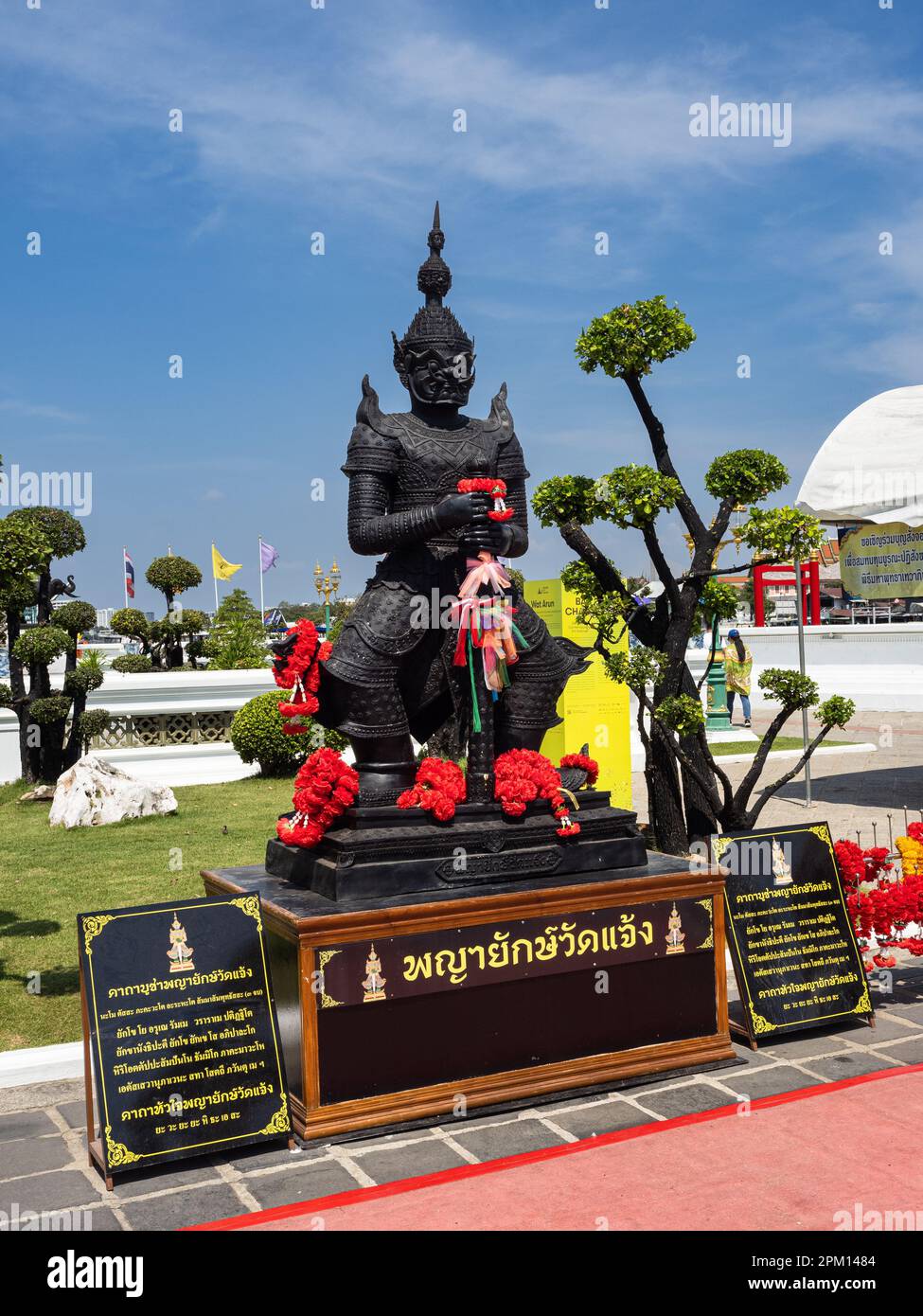 A majestic black statue stands tall against the backdrop of a clear ...
