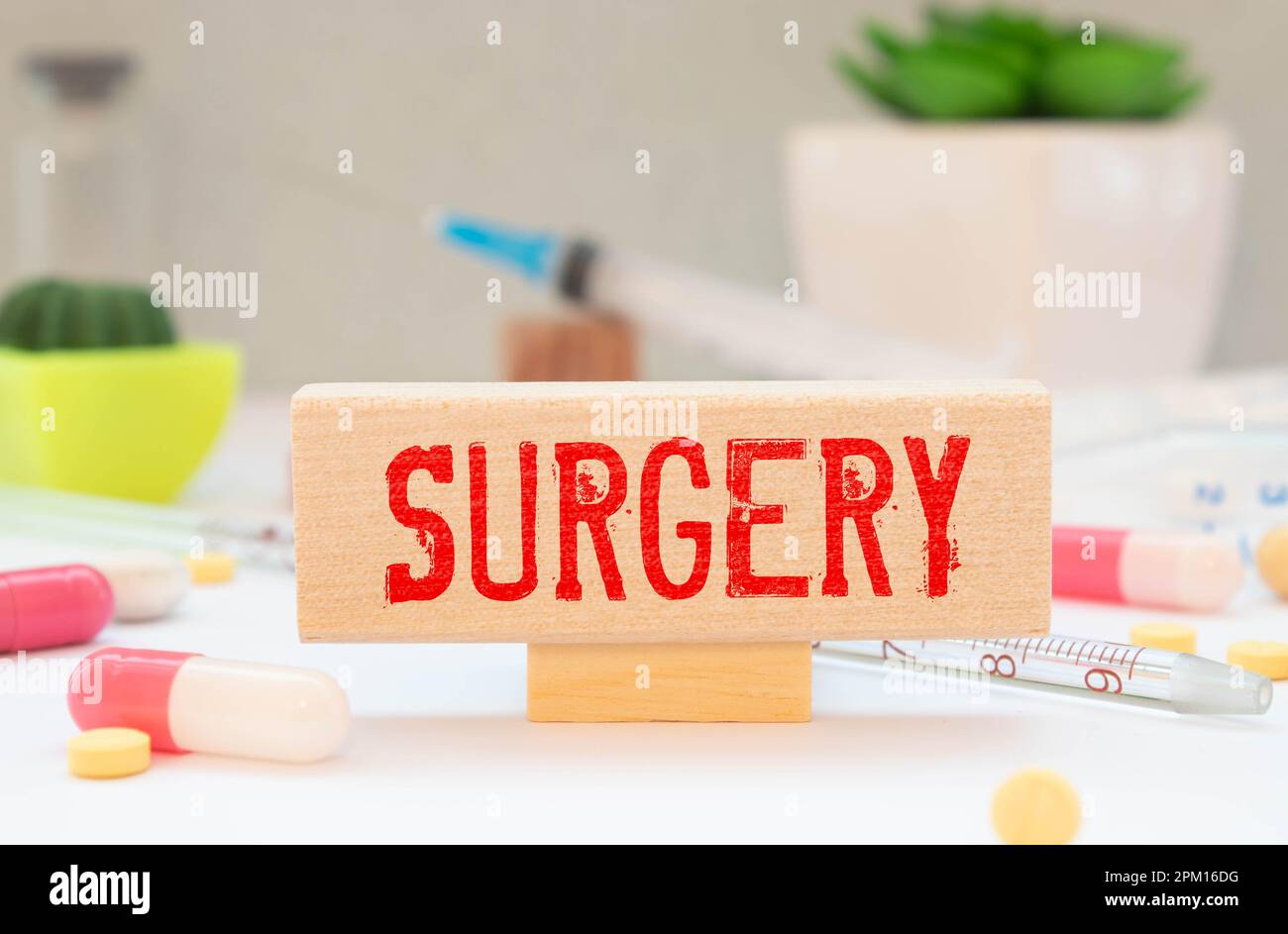 On a blue background, a stethoscope, a pen and a tablet with paper and ...