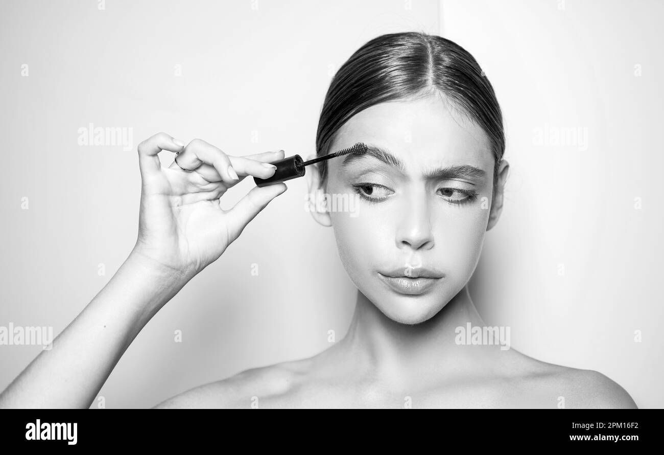 Beauty routine. Girl hold cosmetic applicator. Woman put makeup on her face. Daily makeup ...