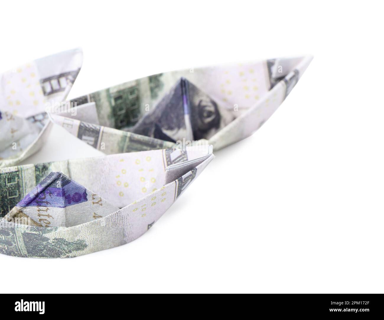 Origami boats made of dollar banknotes on white background Stock Photo ...