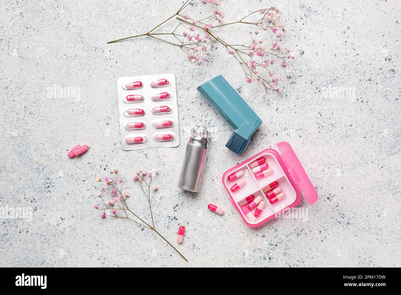 Asthma inhaler with pills and flowers on grunge background Stock Photo ...