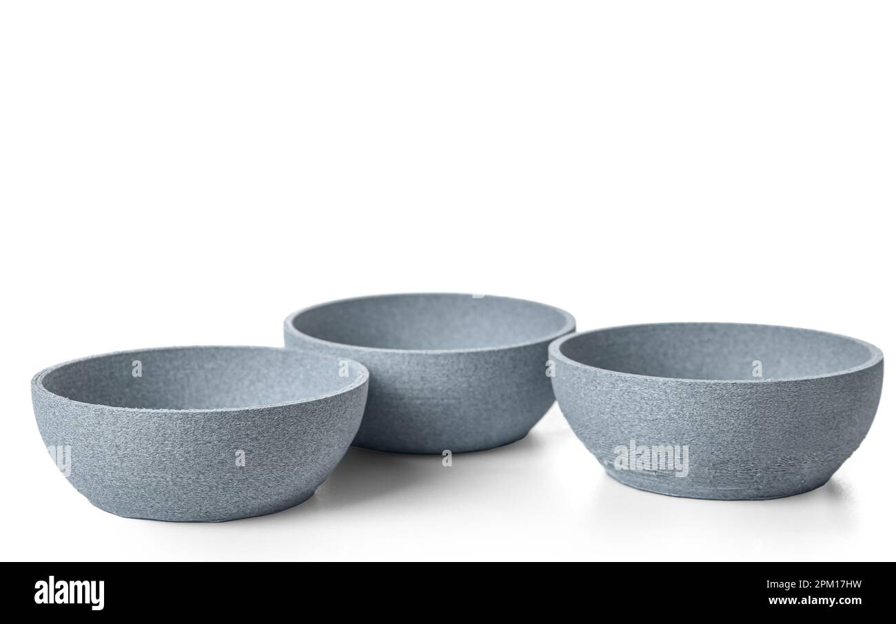 Decorative plaster bowls isolated on white background Stock Photo - Alamy