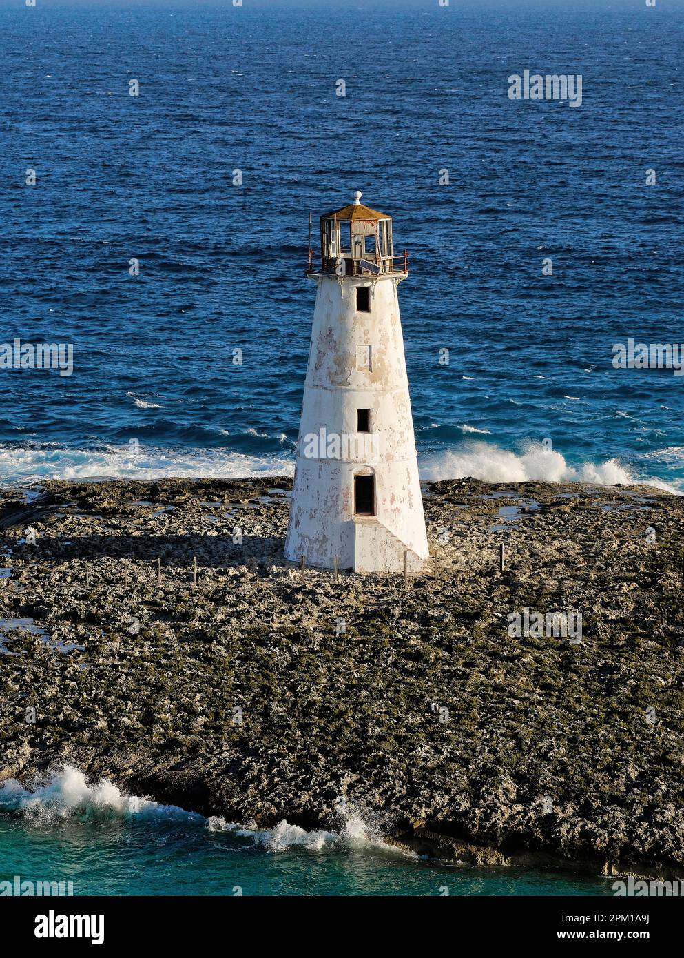 An old lighthouse on a point of land in the Bahamas near Nassau Stock ...