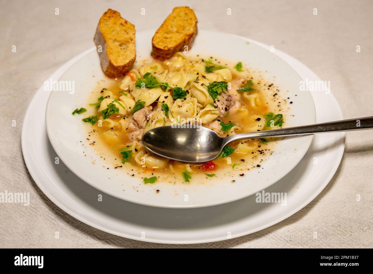 Traditional chicken agnolini (capeletti) soup. winter soup Stock Photo ...
