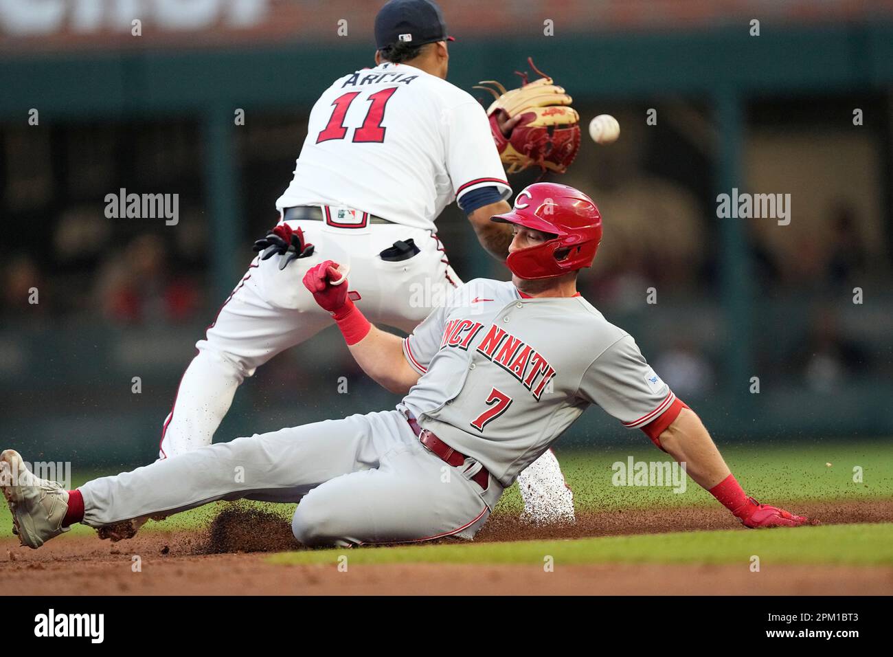 Cincinnati Reds' Spencer Steer (7) slides into second base with a ...