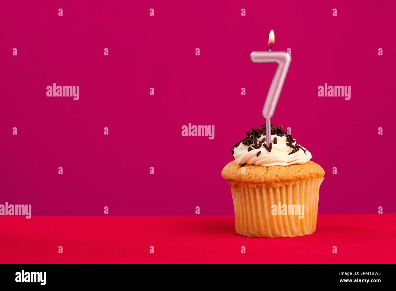 Birthday cake with candle number 7 - Rhodamine Red foamy background ...