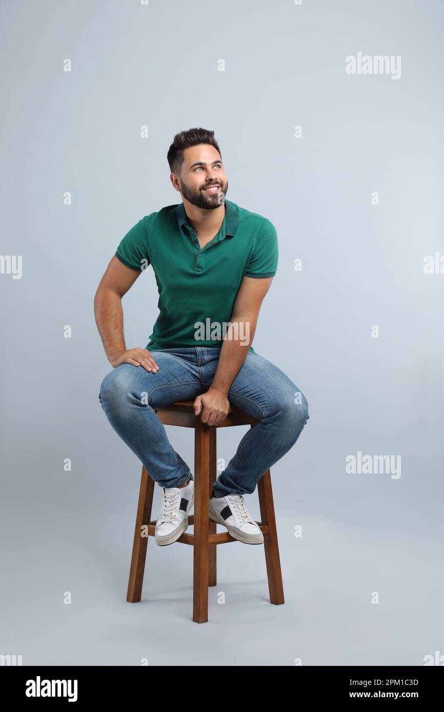 Reference Sitting On Stool