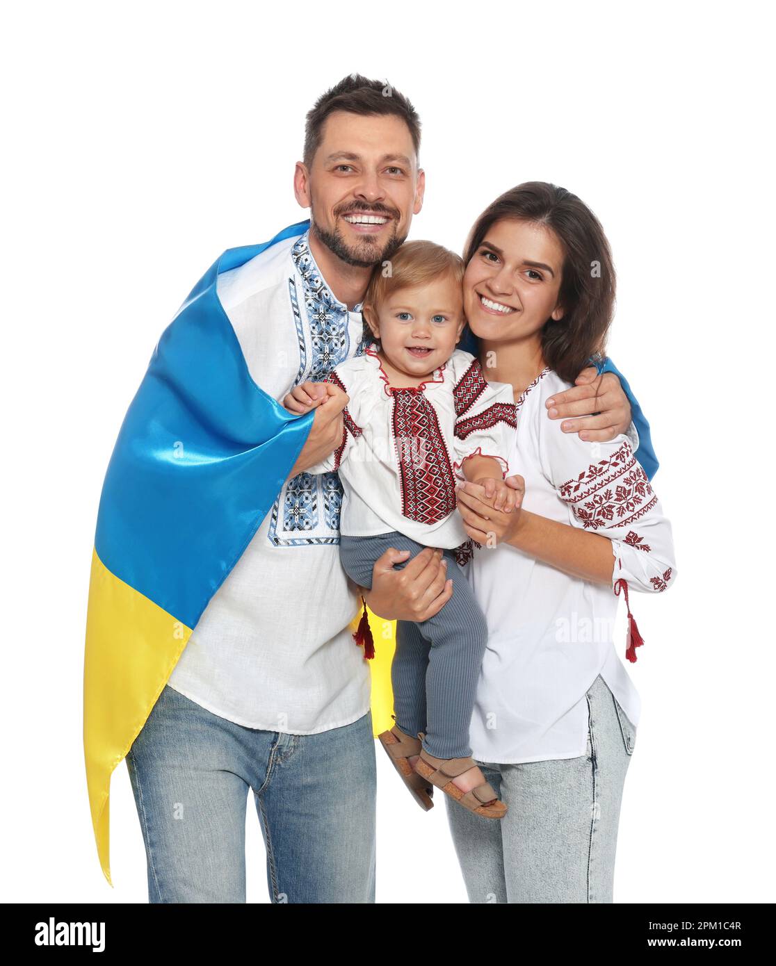 Happy family in national clothes with flag of Ukraine on white ...