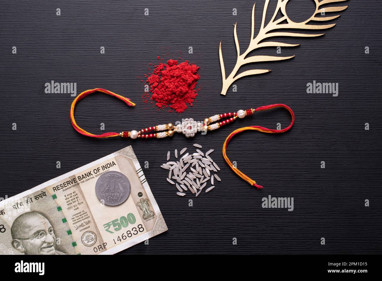 Top view of luxury rakhi with roli and indian currency Stock Photo - Alamy