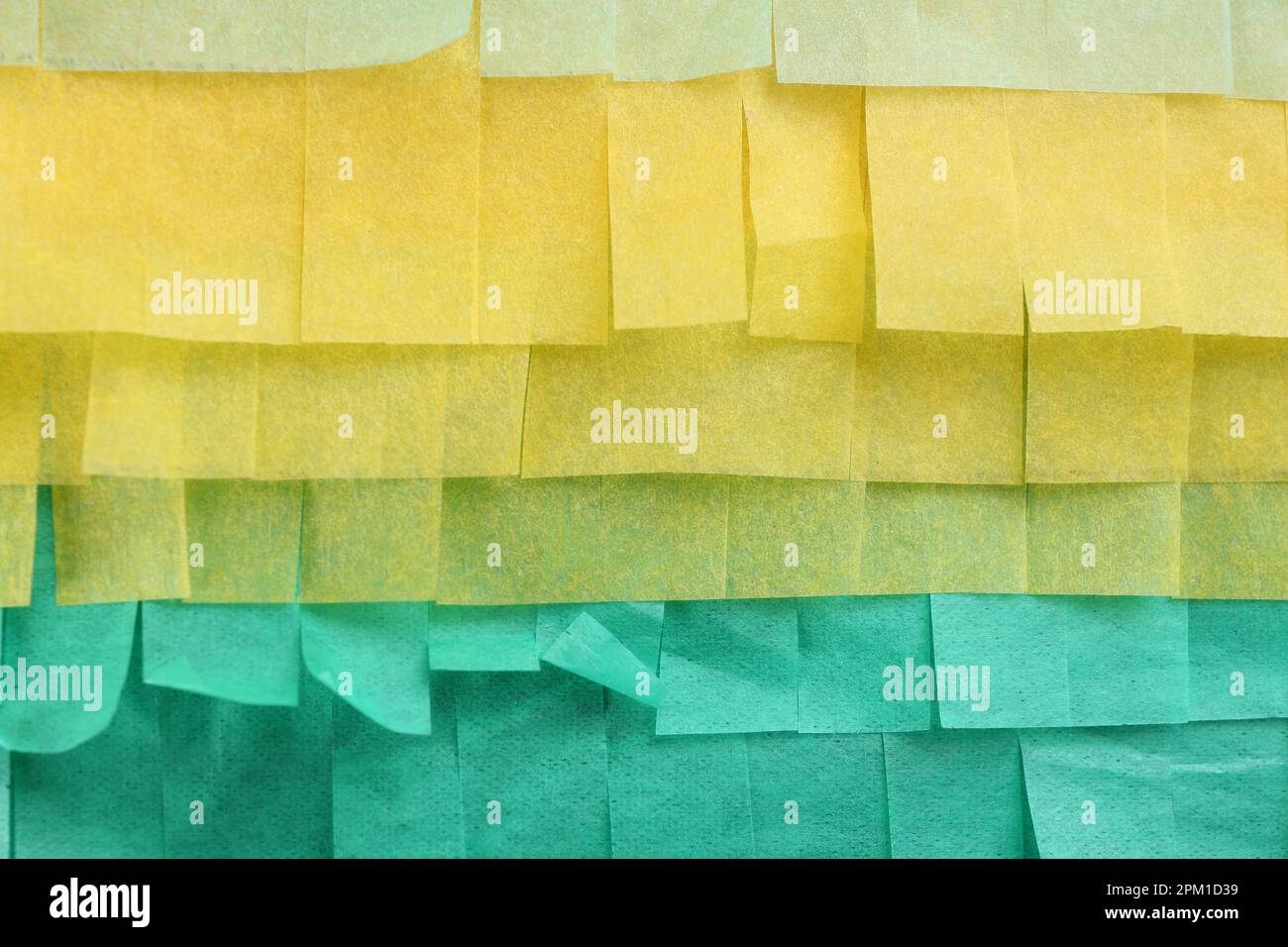 Cut tissue paper in different colors as background Stock Photo - Alamy