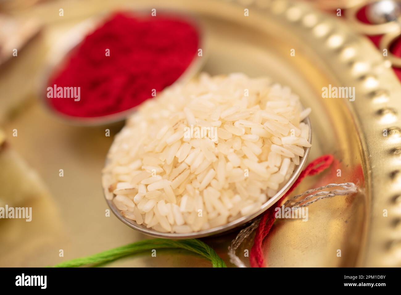 Closeup of rice in pooja thali Stock Photo - Alamy