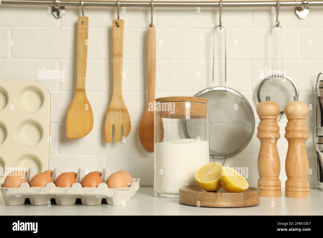 Countertop with cooking utensils and products in kitchen Stock Photo ...