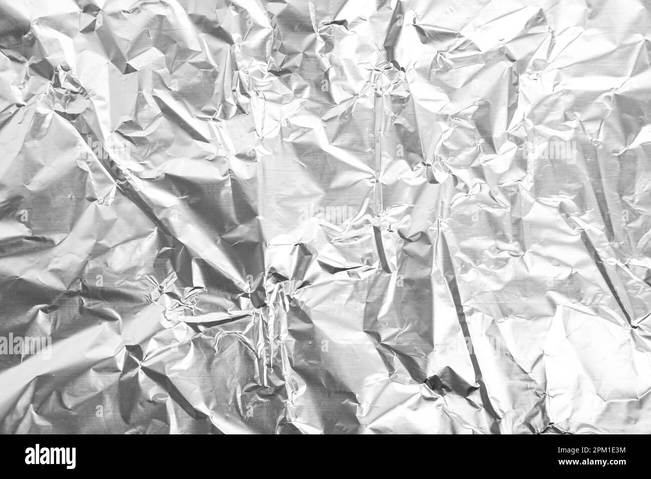 Crumpled silver foil as background, closeup view Stock Photo - Alamy