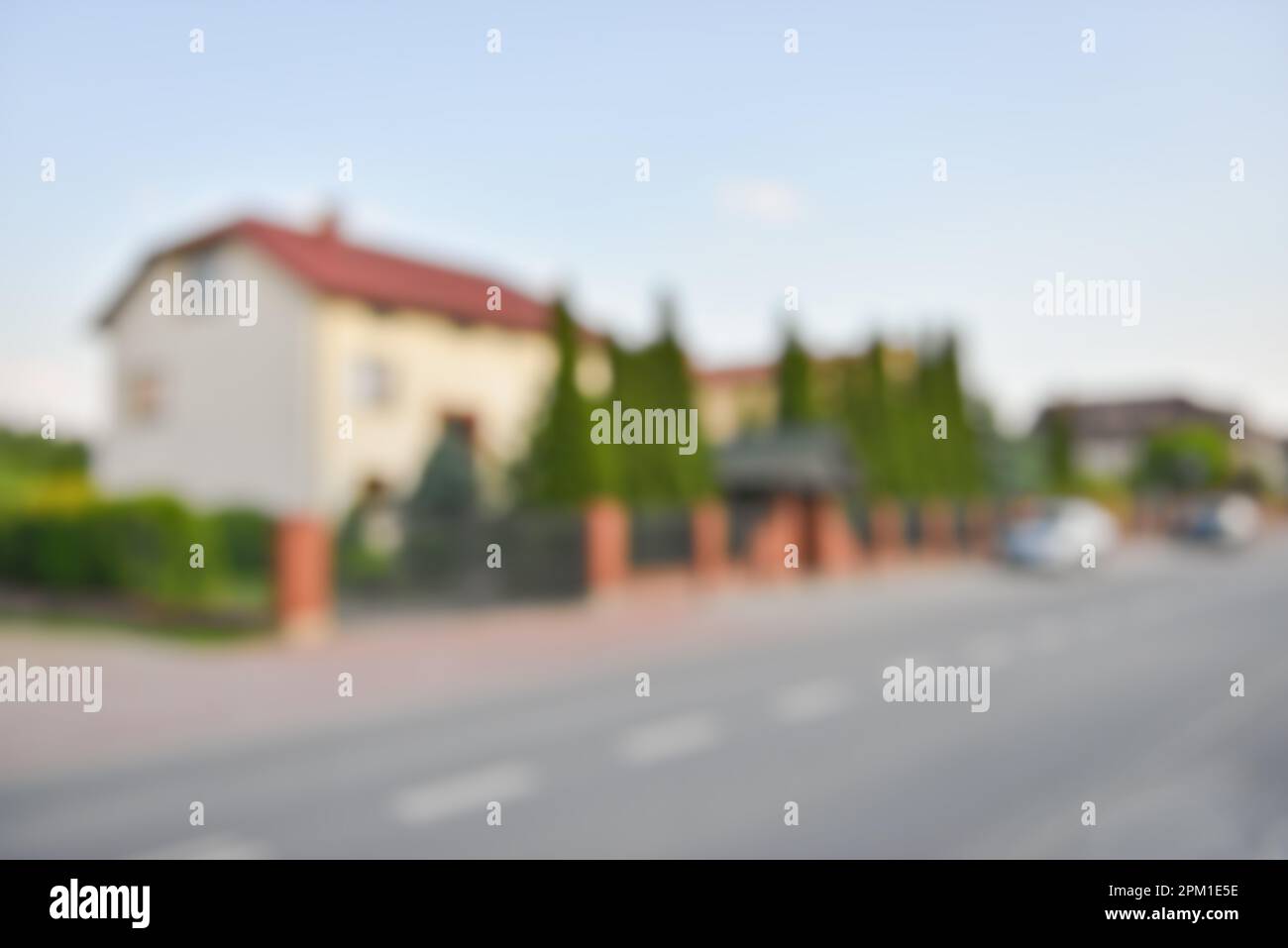 Blurred view of suburban street with beautiful house Stock Photo - Alamy