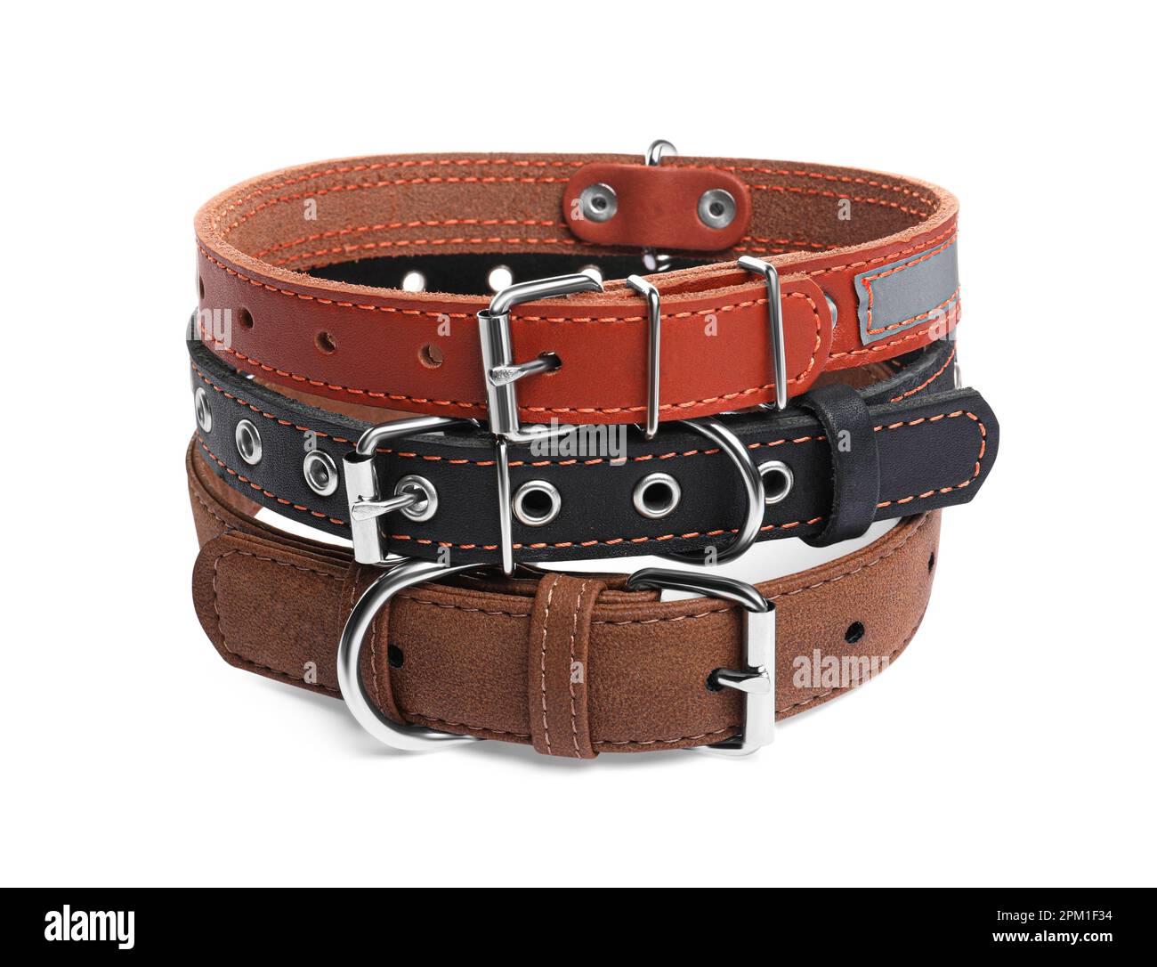 Different leather dog collars on white background Stock Photo - Alamy