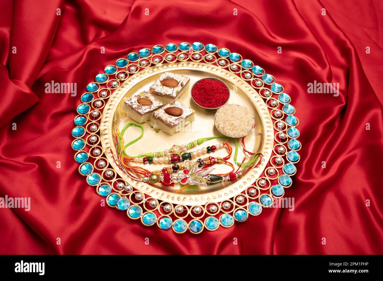 Rakhi with indian sweets and roli rice for raksha bandhan Stock Photo ...
