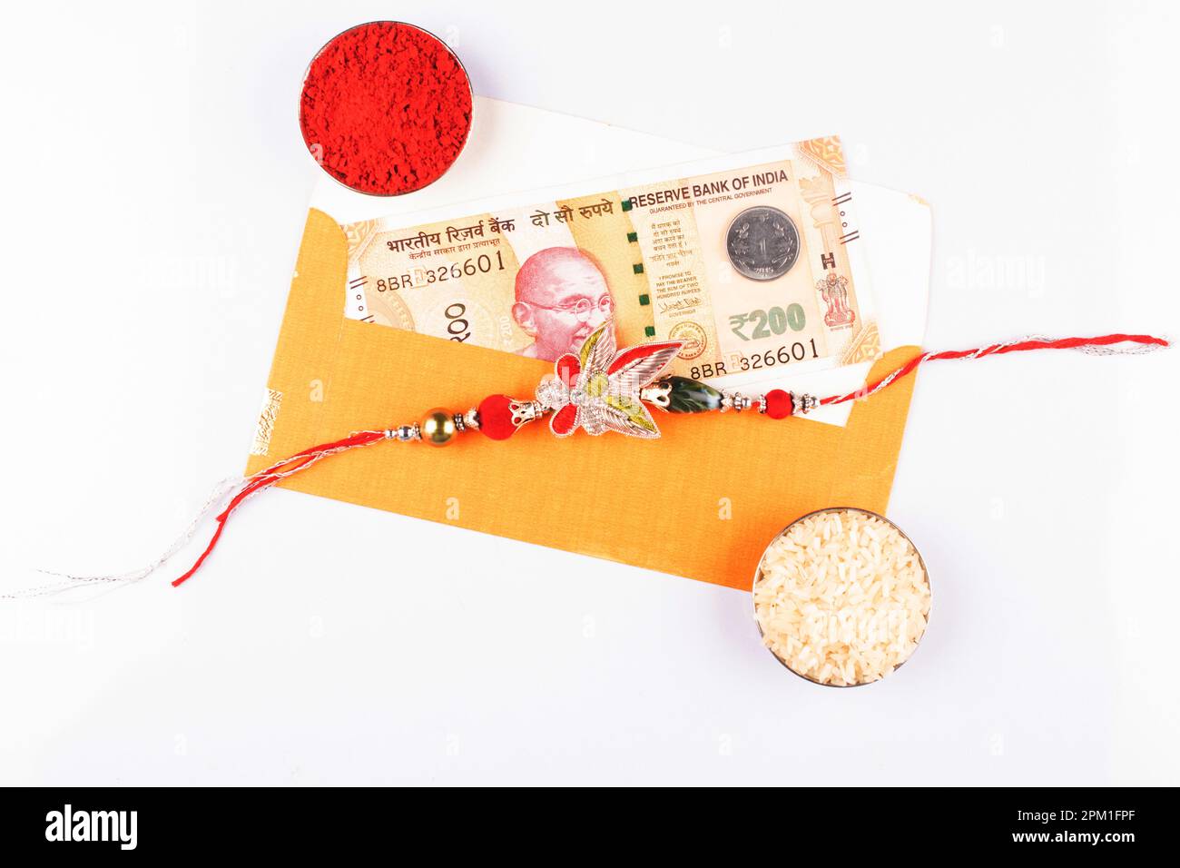 Rakhi with shagun and kumkum on white background Stock Photo - Alamy
