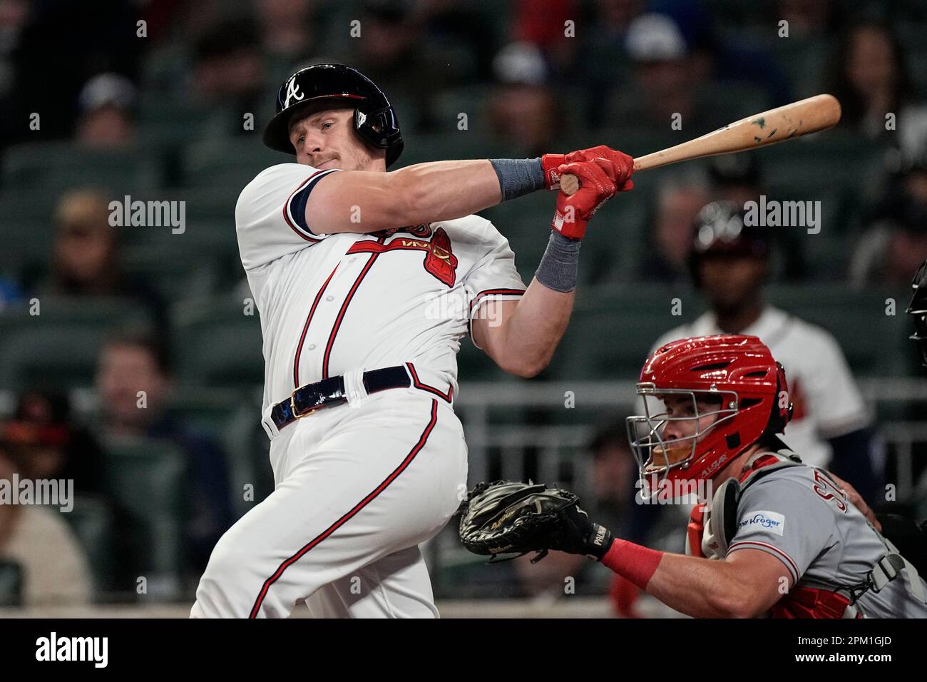 Atlanta Braves' Sean Murphy, left, drives in a run with a double as ...