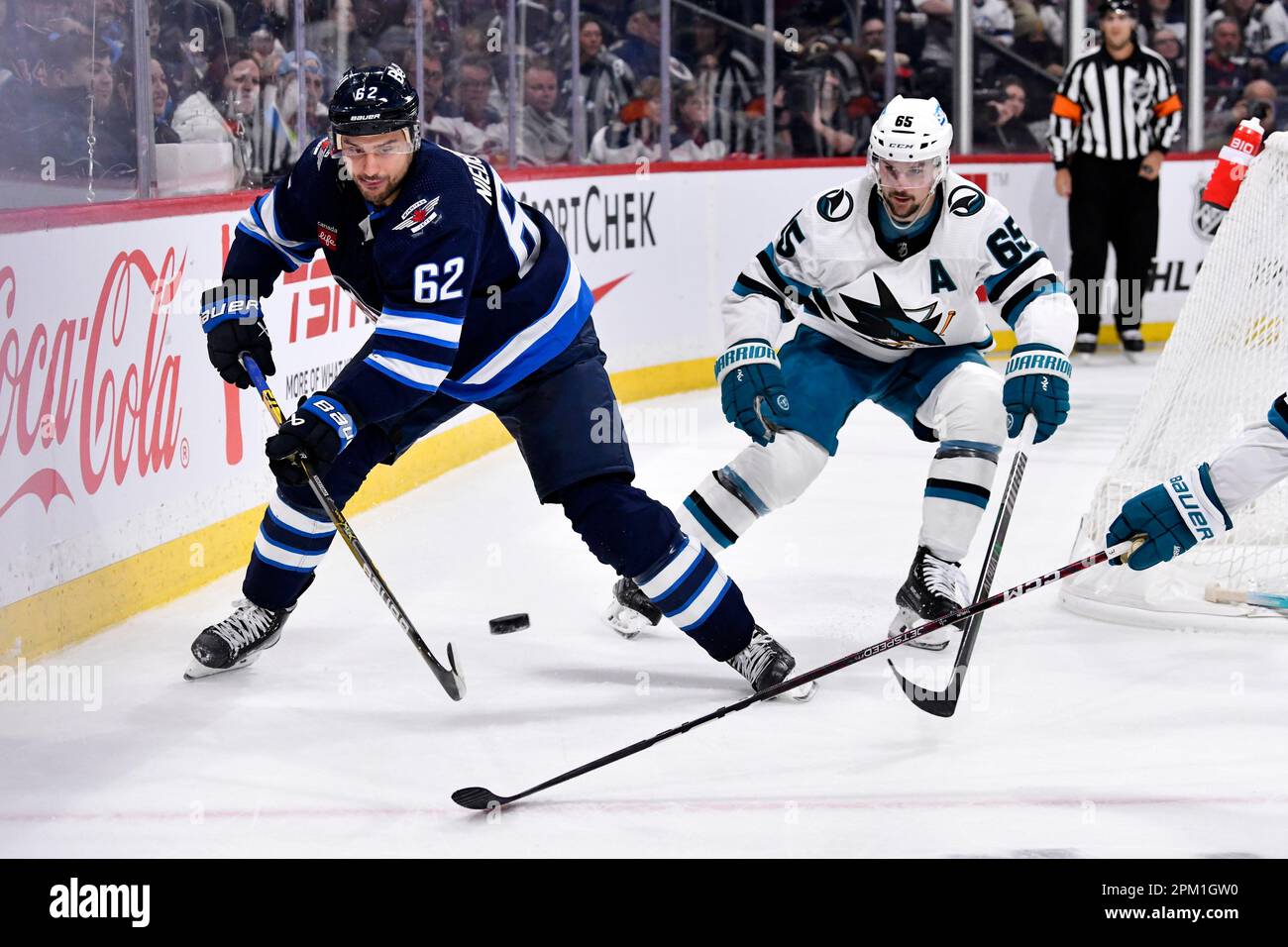 Winnipeg Jets' Nino Niederreiter (62) passes the puck past San Jose ...