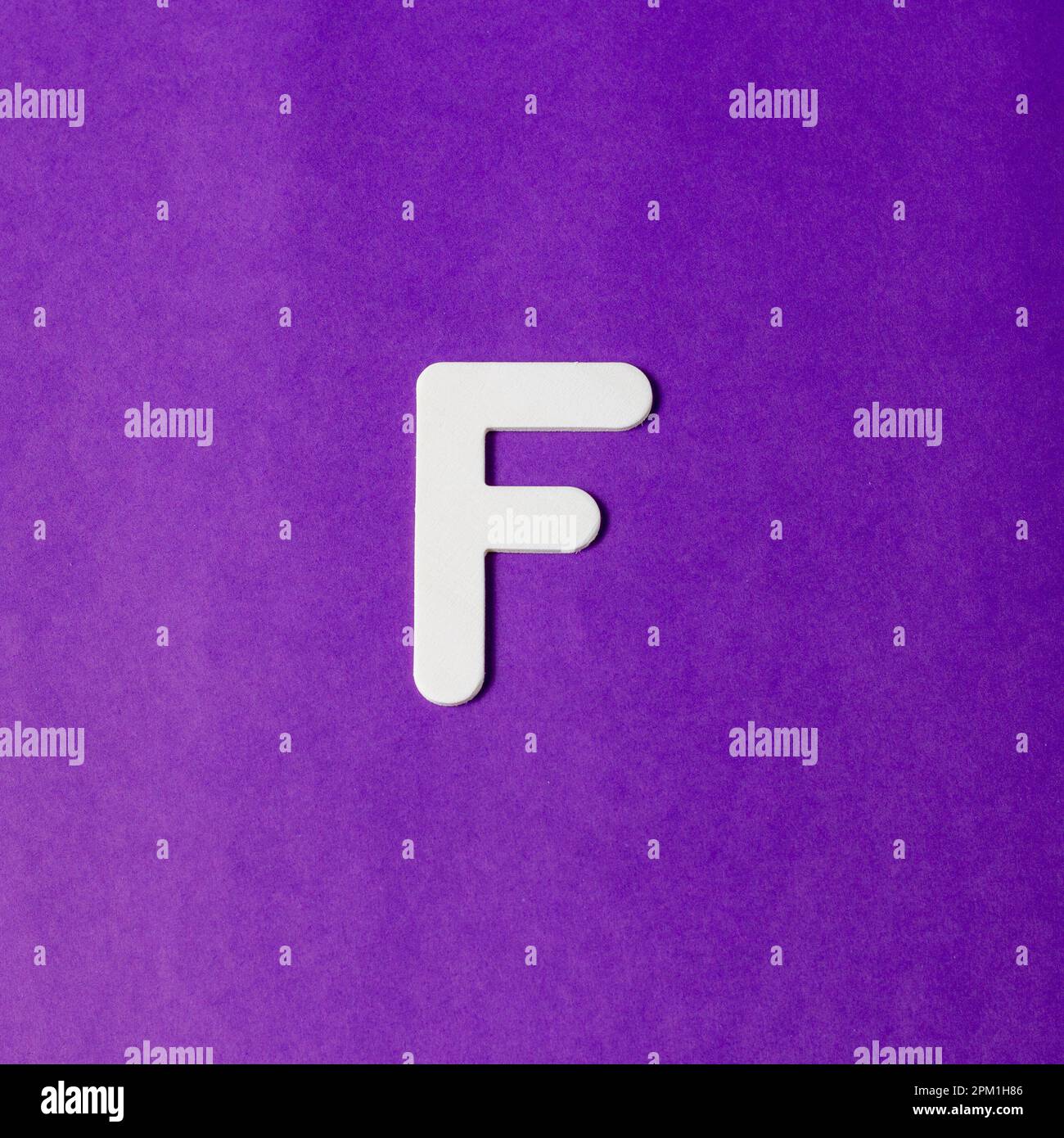 Uppercase letter F - wood texture - Purple background Stock Photo - Alamy