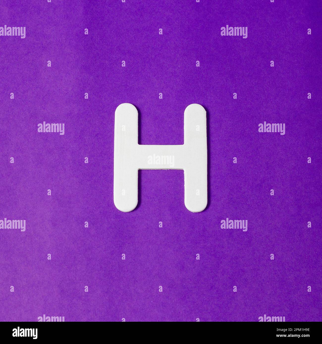 Uppercase letter H - wood texture - Purple background Stock Photo - Alamy