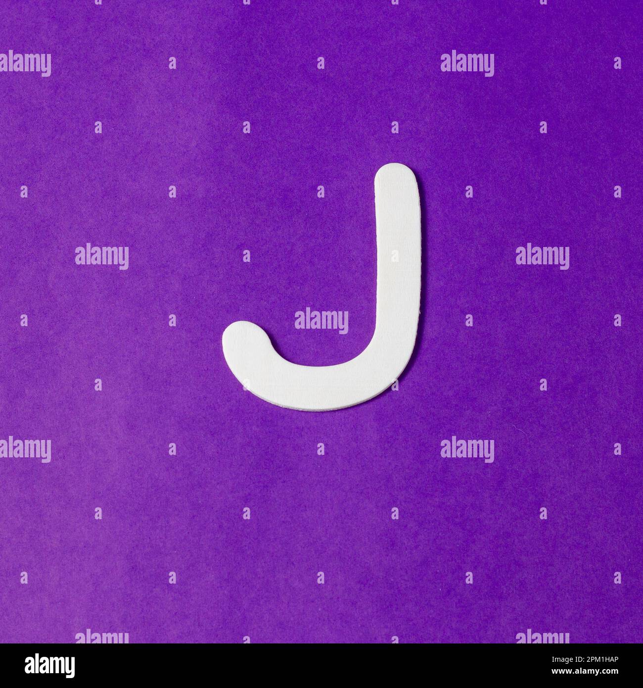Uppercase letter J - wood texture - Purple background Stock Photo - Alamy