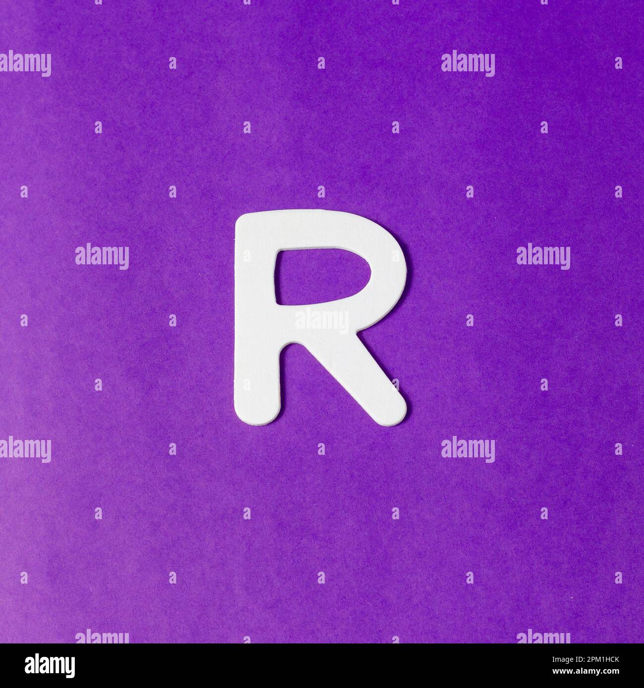 Uppercase letter R - wood texture - Purple background Stock Photo - Alamy