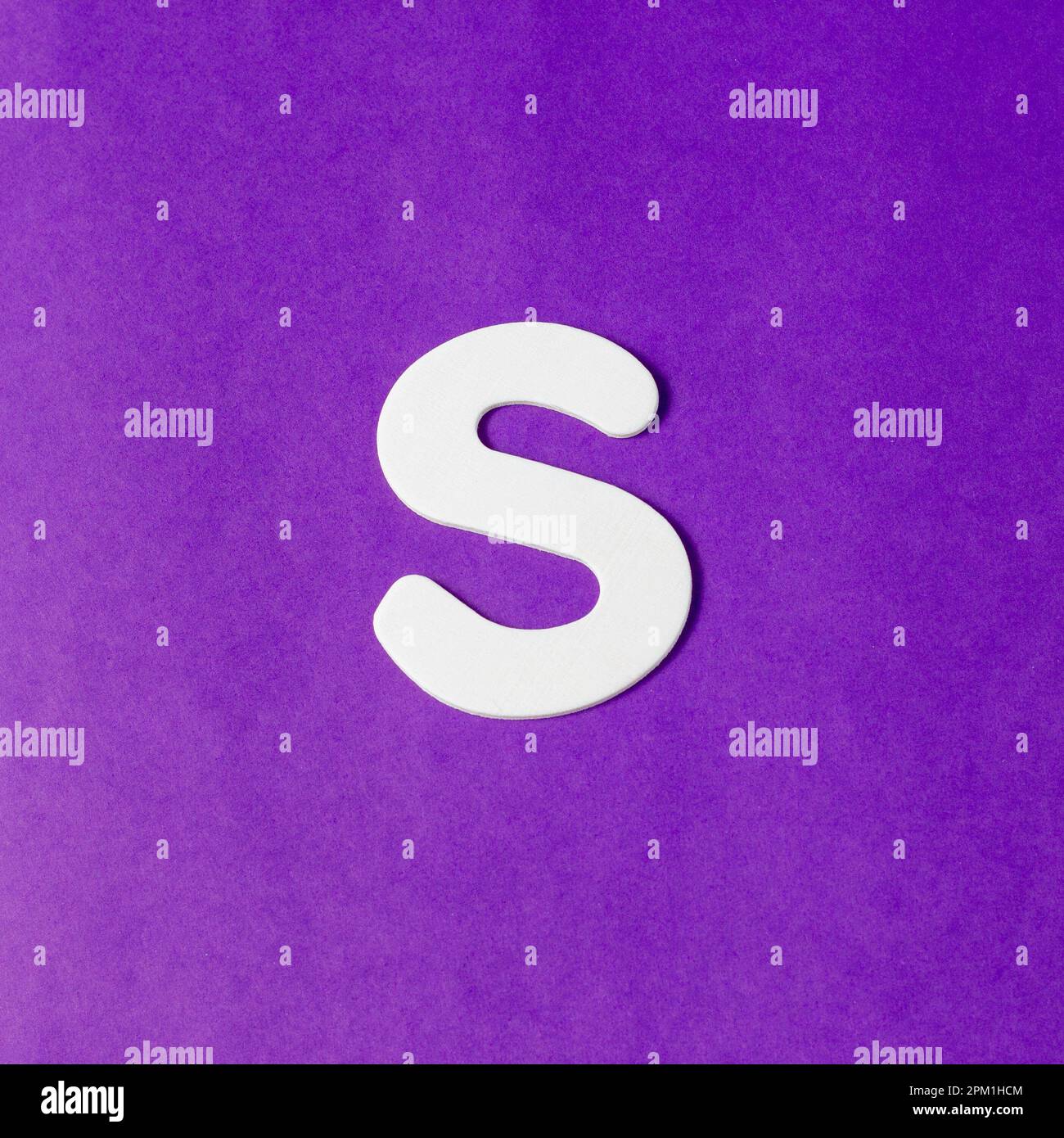 Letter S in wood texture - Purple background Stock Photo - Alamy