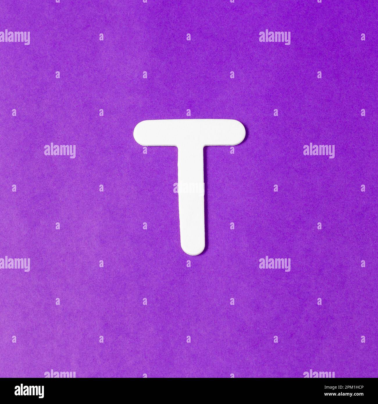 Uppercase letter T - wood texture - Purple background Stock Photo - Alamy