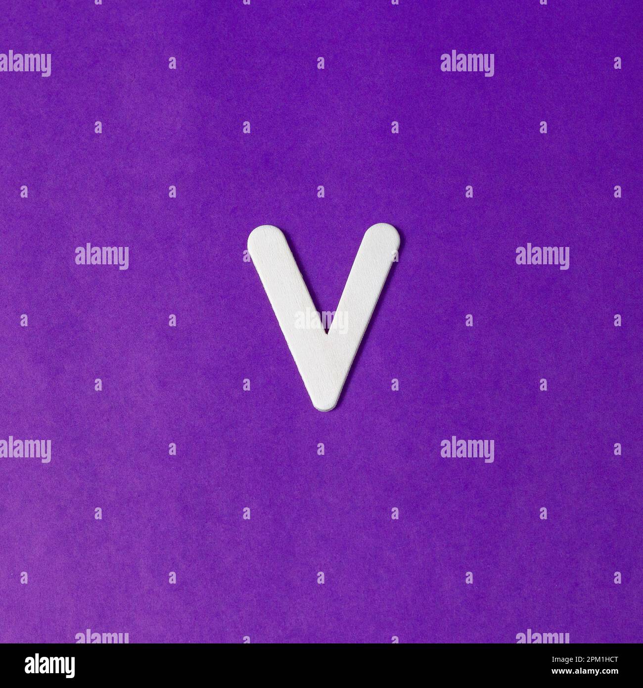 Uppercase letter V - wood texture - Purple background Stock Photo - Alamy