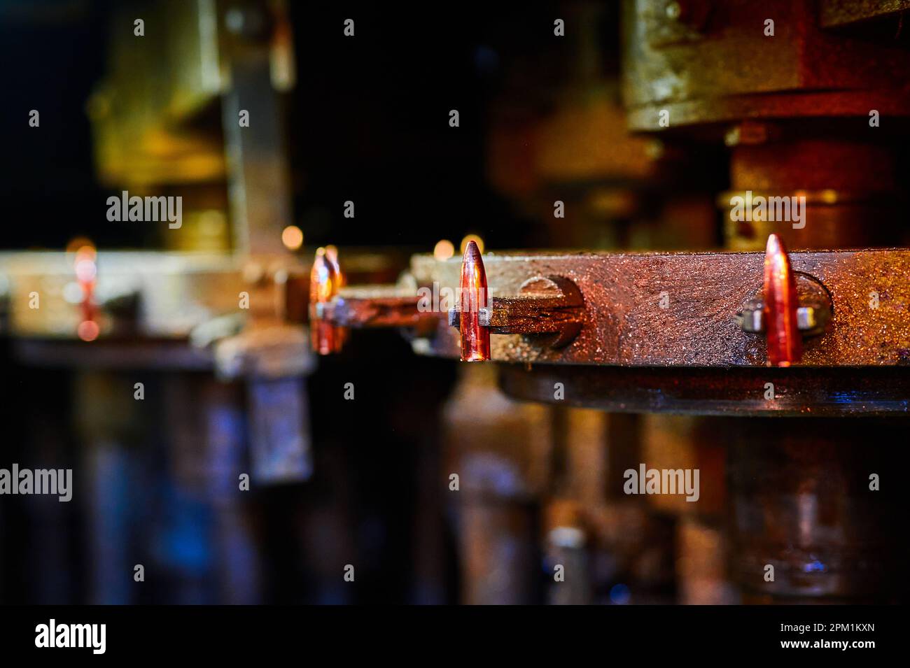 Round clamp with shiny bullet at ammo factory shop closeup Stock Photo ...