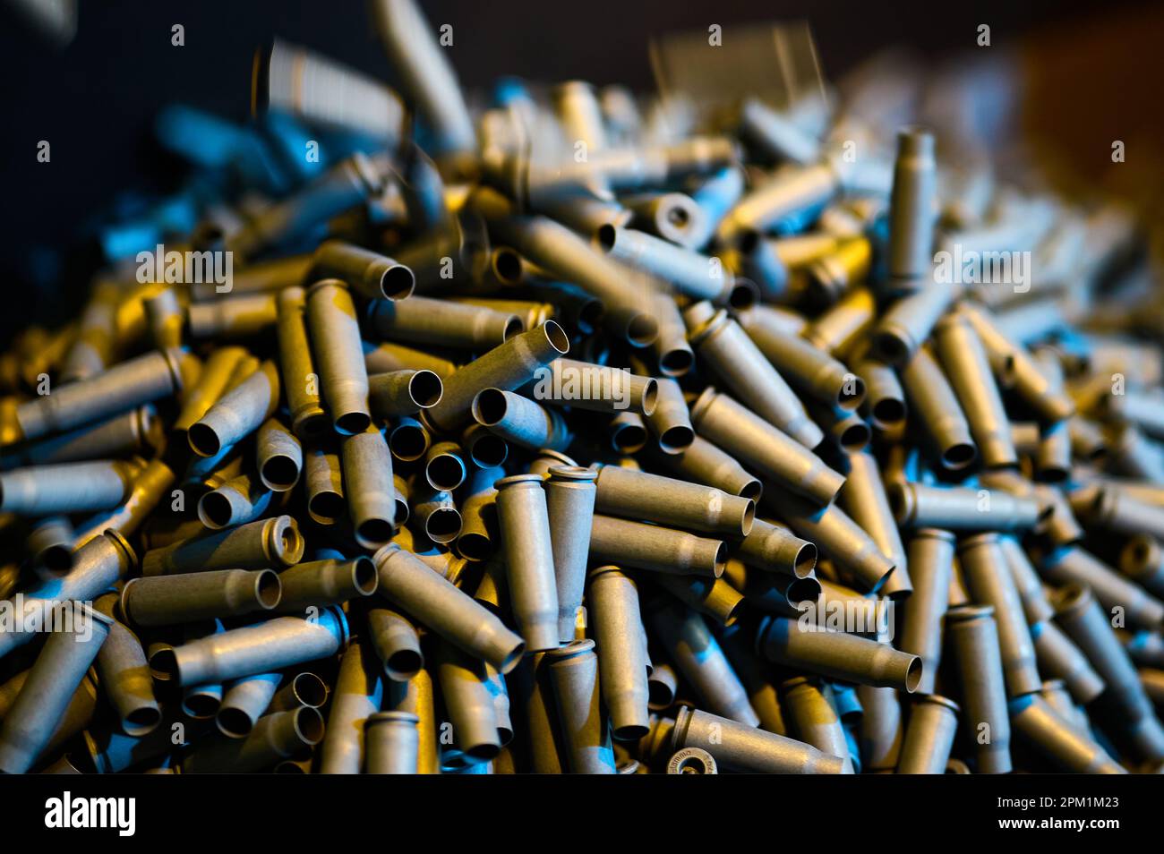 Bullet casings pile in weapon production plant storage Stock Photo - Alamy