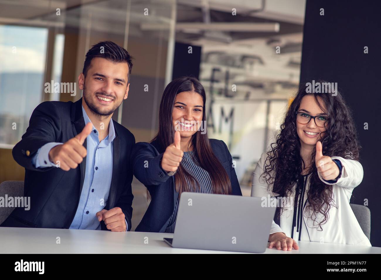 Focused startup team using laptops hi-res stock photography and images ...