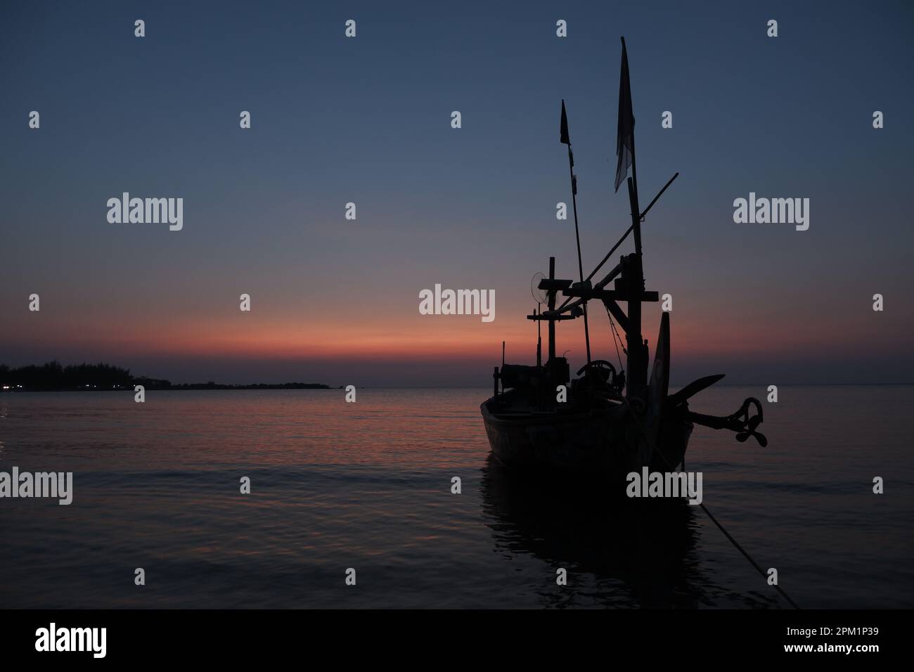 Boat on Purple Sunset Stock Photo - Alamy