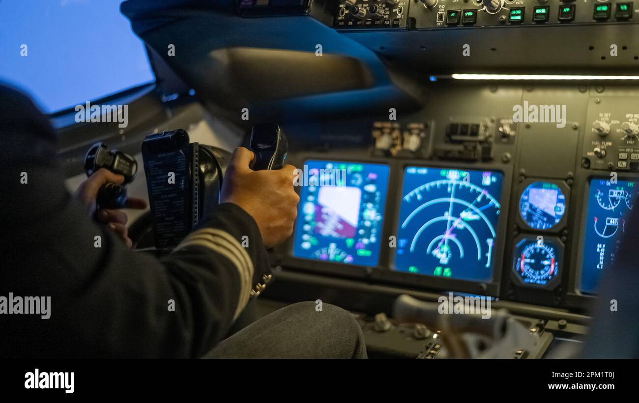 A man is studying to be a pilot in a flight simulator. Close-up of male ...