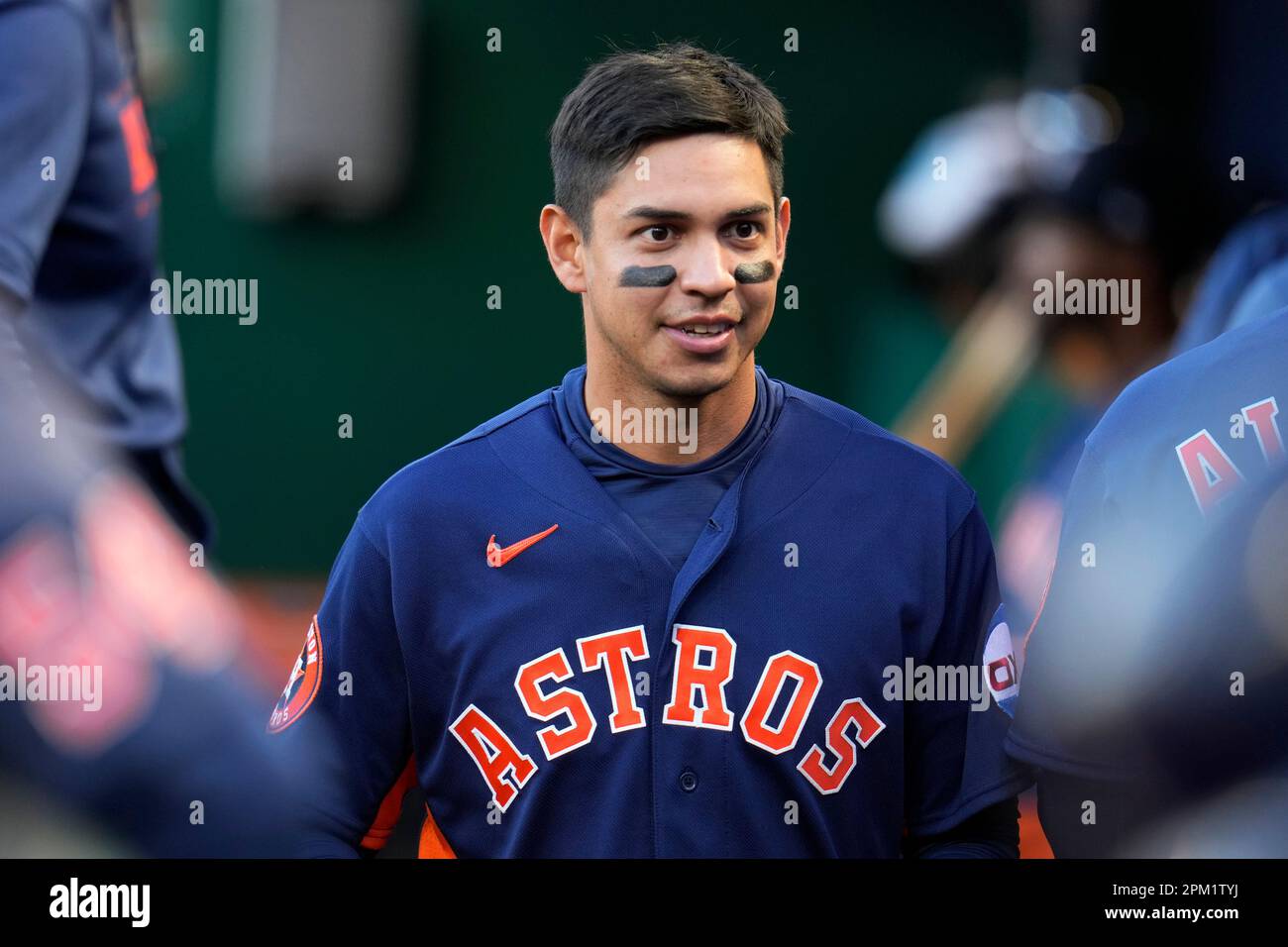 Houston Astros' Mauricio Dubon walks in the dugout before a baseball ...