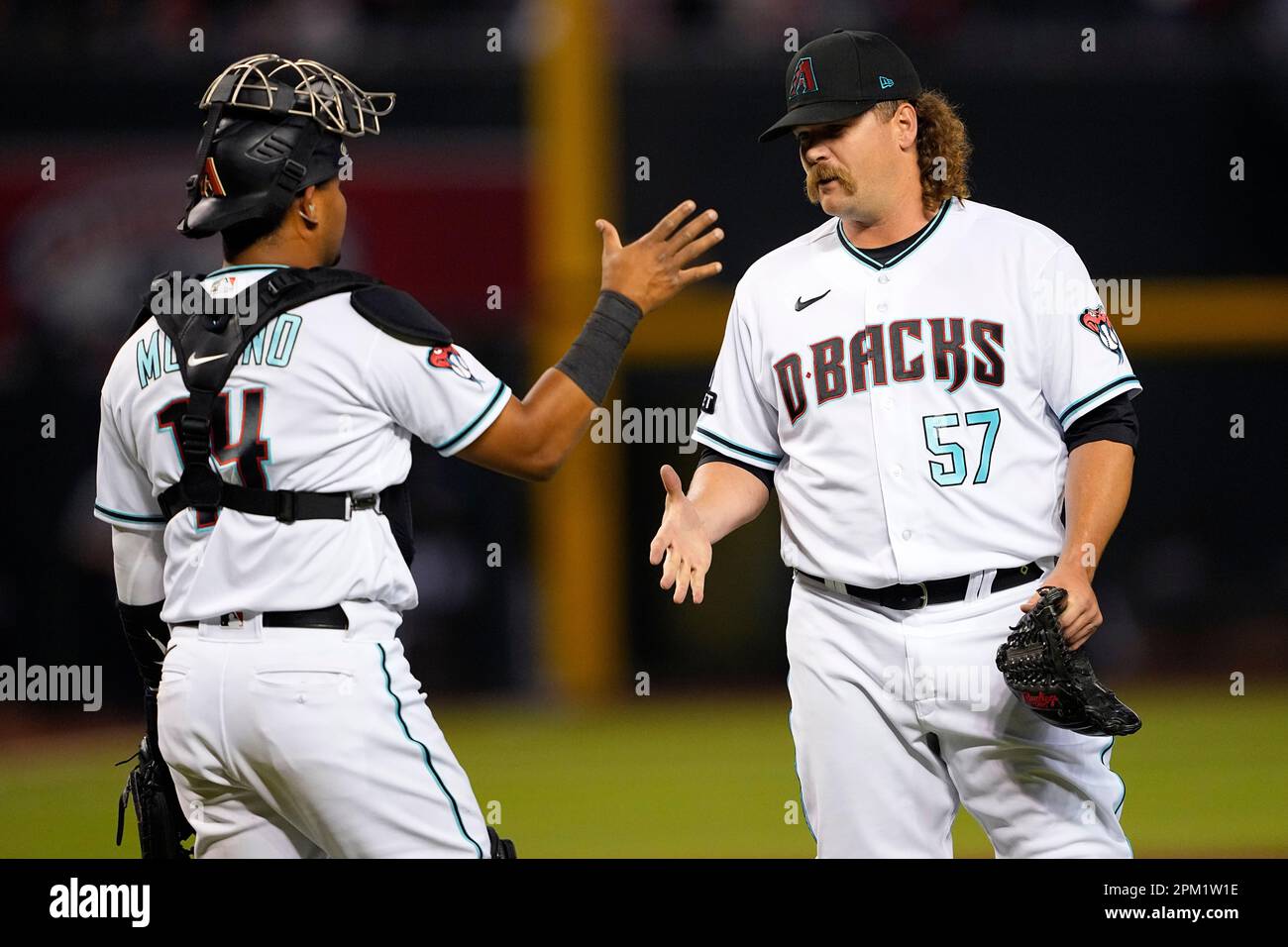 Arizona Diamondbacks relief pitcher Andrew Chafin (57) greets catcher ...