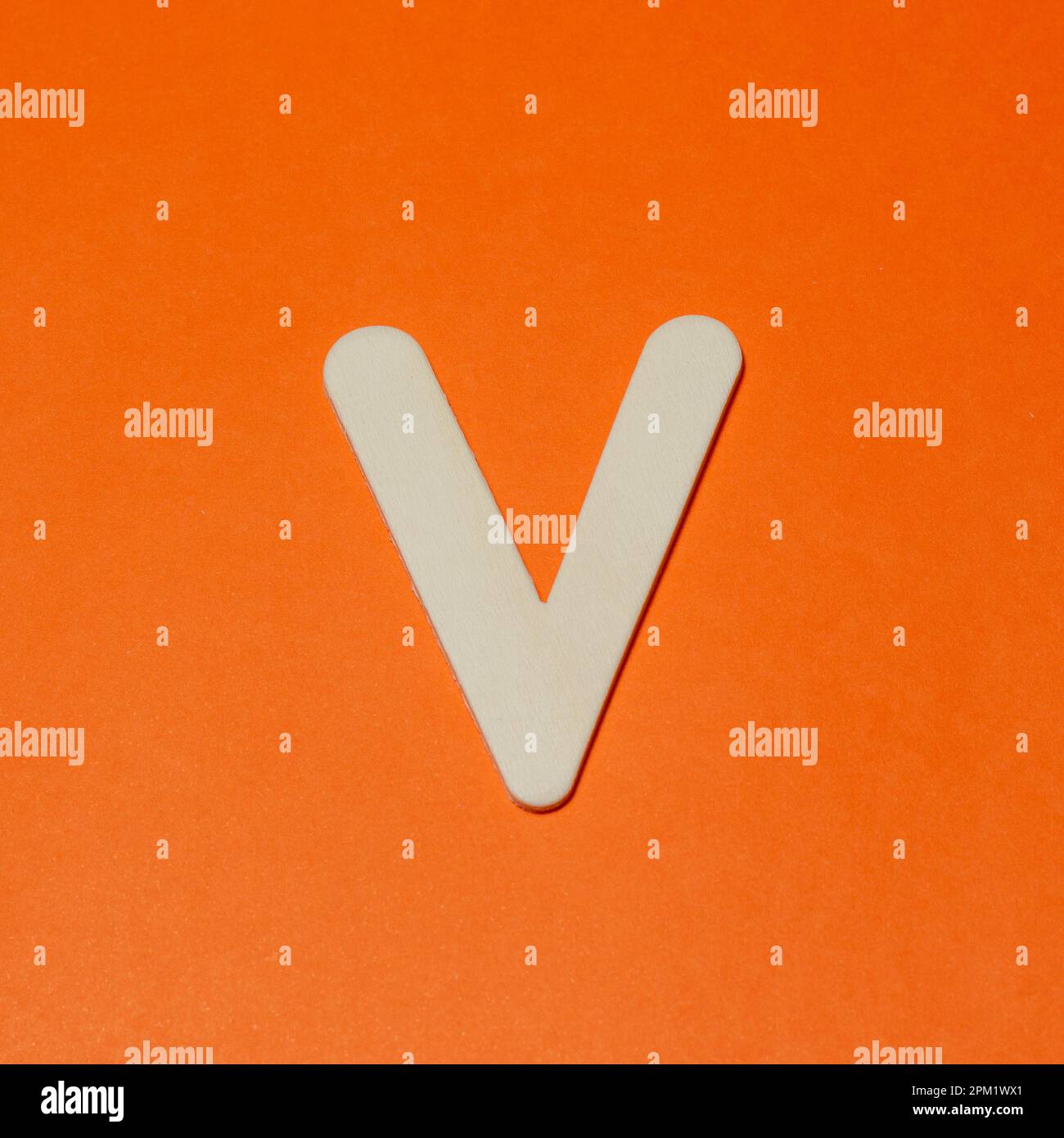 Uppercase letter V - wood texture - Orange background Stock Photo - Alamy
