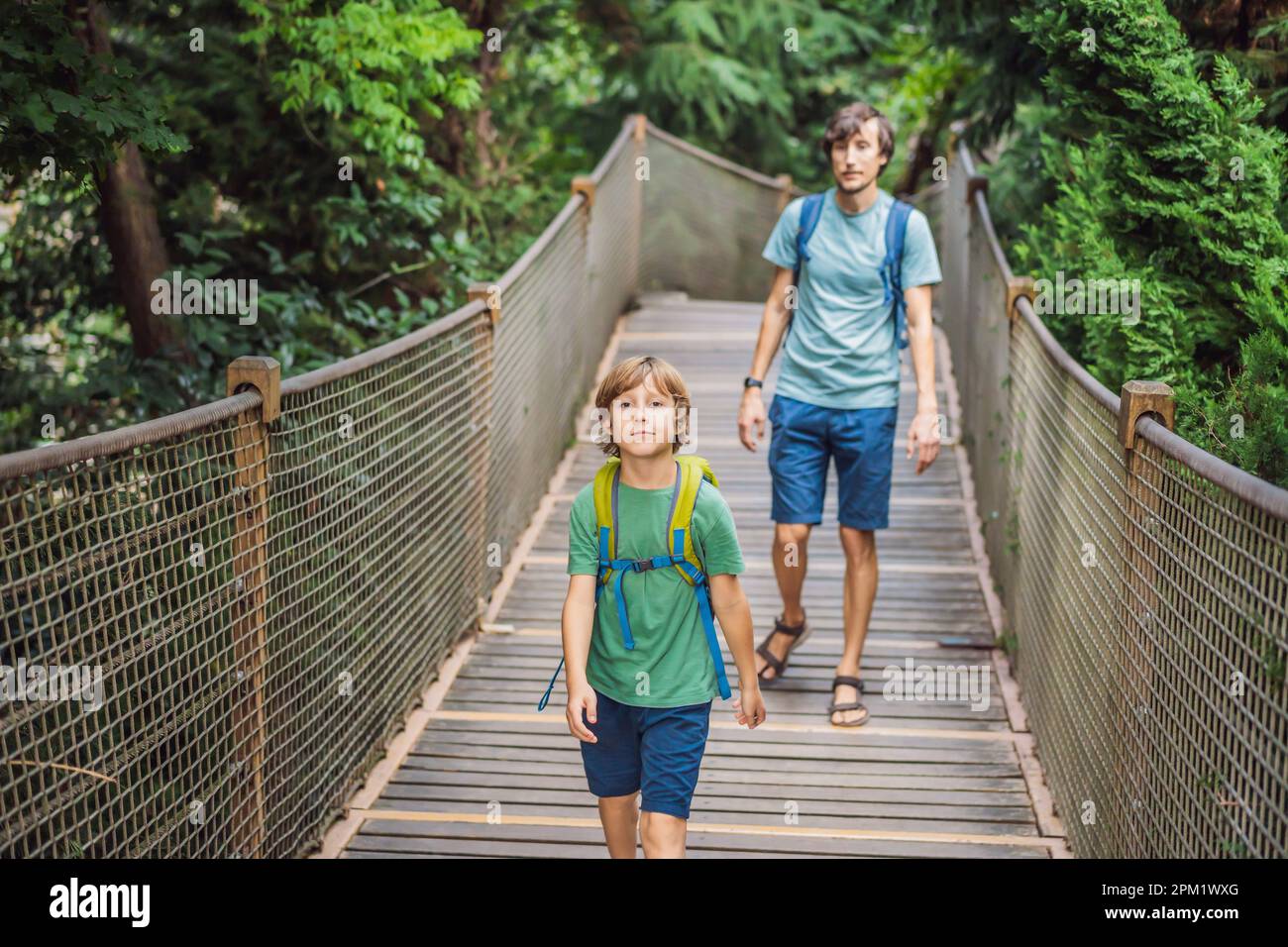 father and son tourists in Rope bridge in Yildiz Park. Besiktas ...