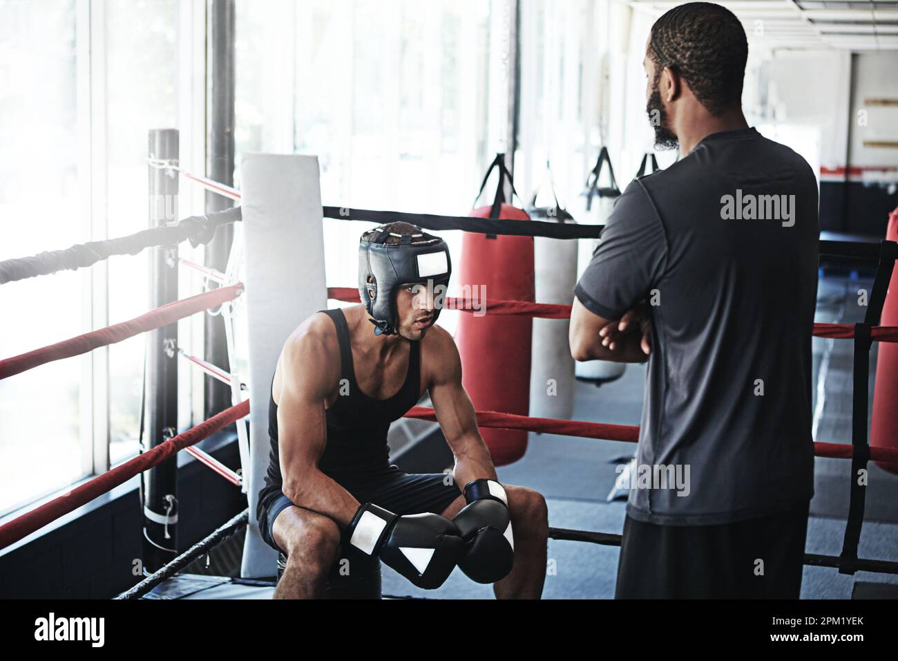 Developing him into the boxer he was born to be. a man training in the ...