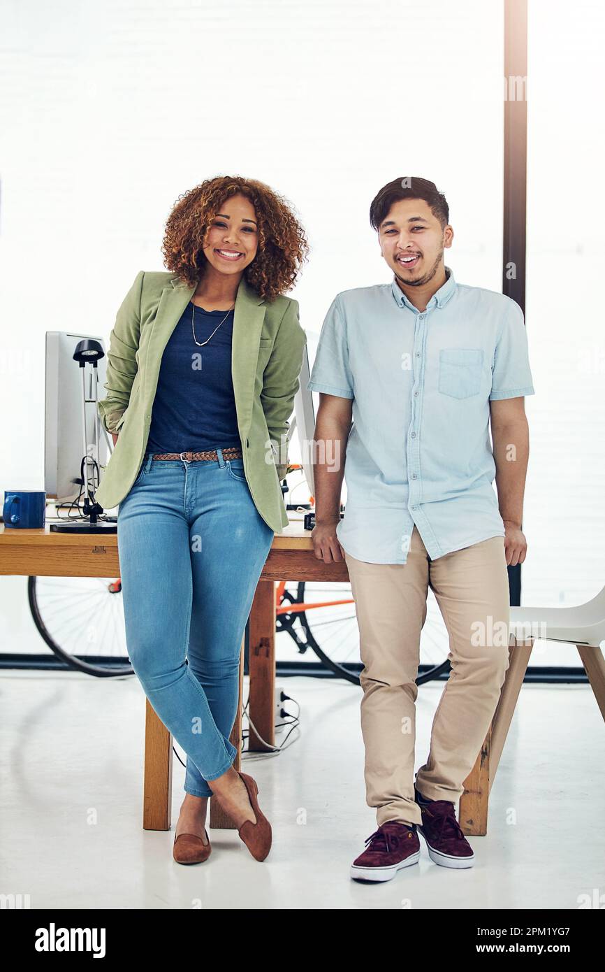 Were a dynamic duo. Portrait of two happy creatives posing together in ...