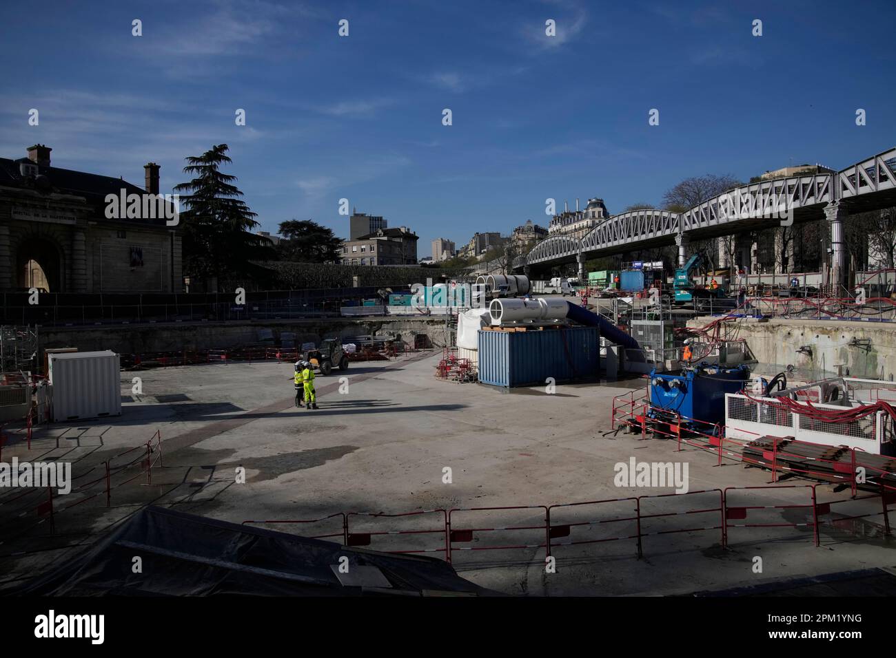 Workers stand at water storage tank construction site in Paris ...