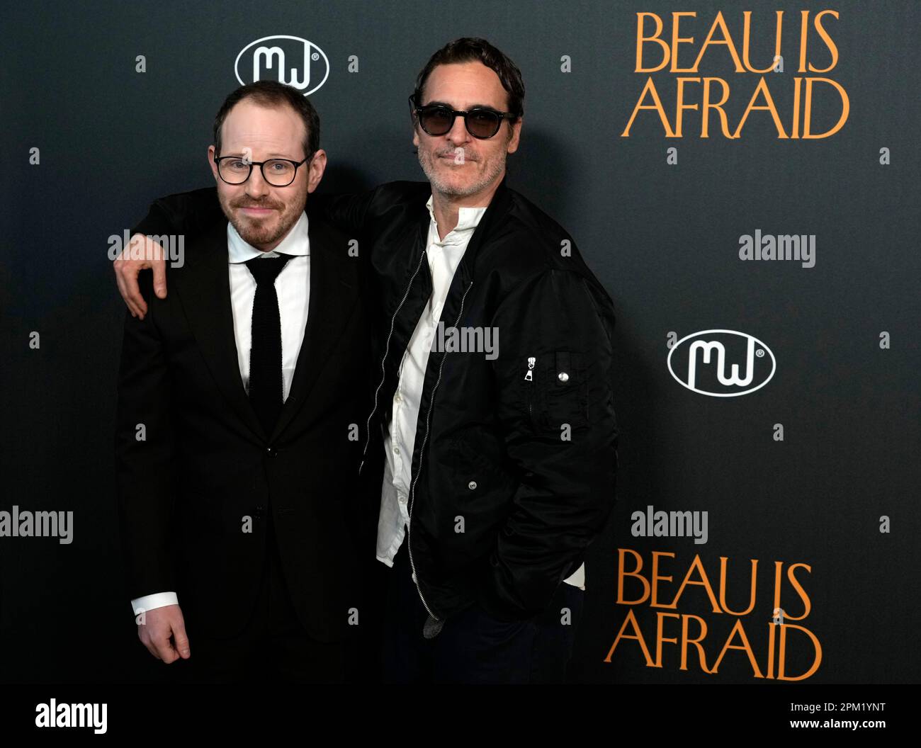 Writer/director Ari Aster, left, and star Joaquin Phoenix pose together at the premiere of the ...