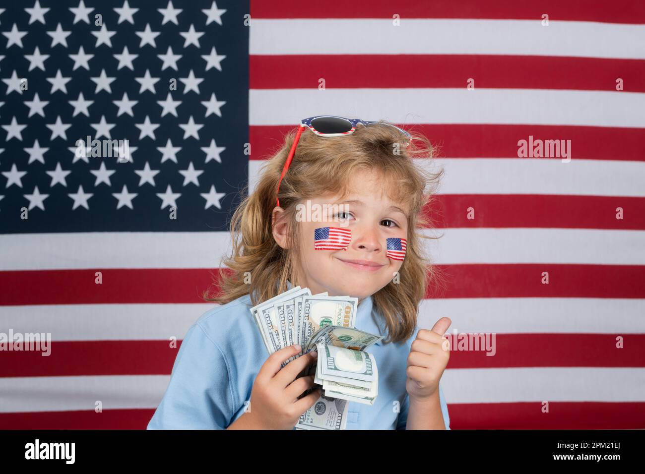 American dollars money banknotes concept. Child with money dollar bills ...