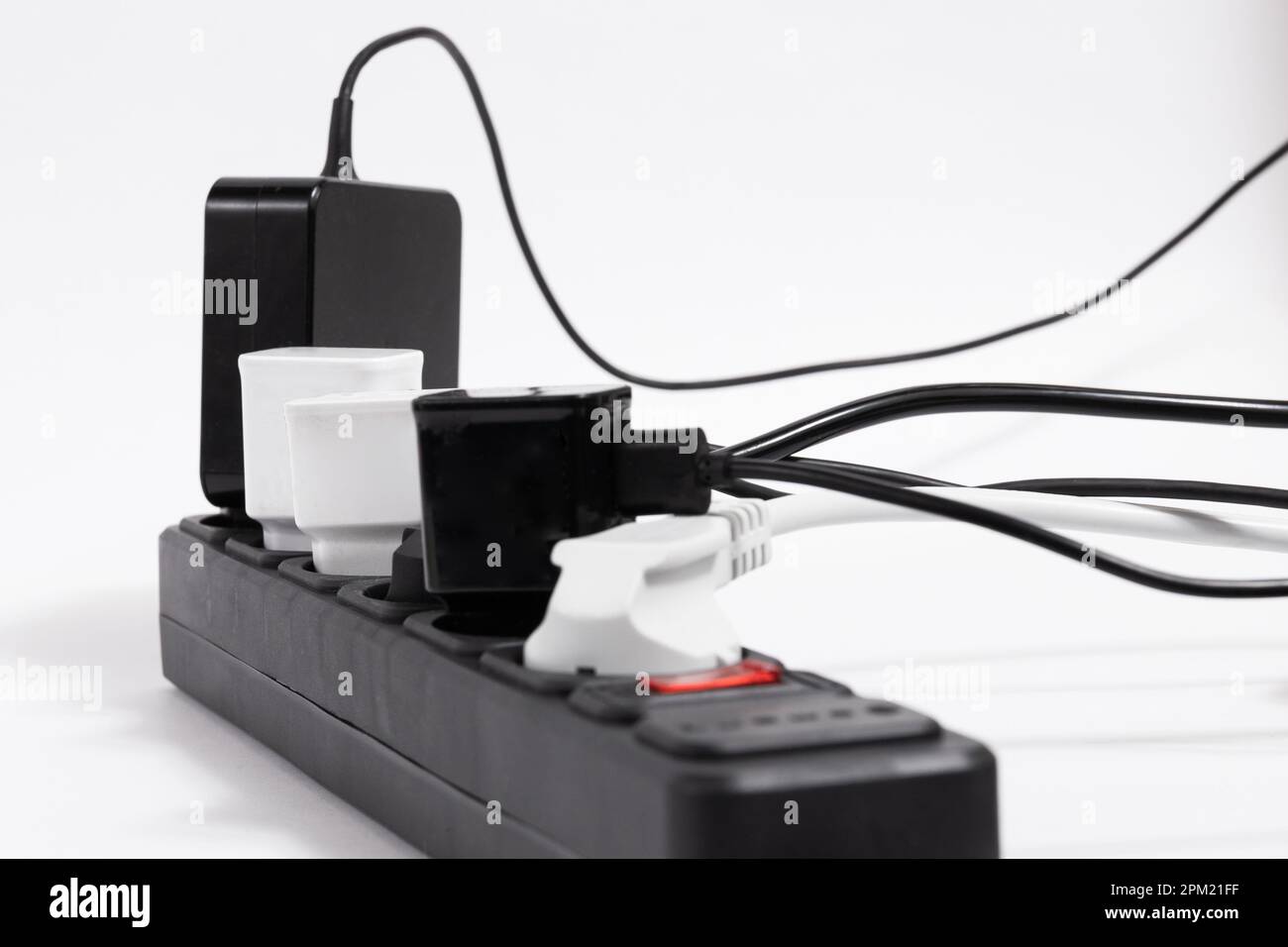 Black extension cord with red power on off button and many plugs Stock ...