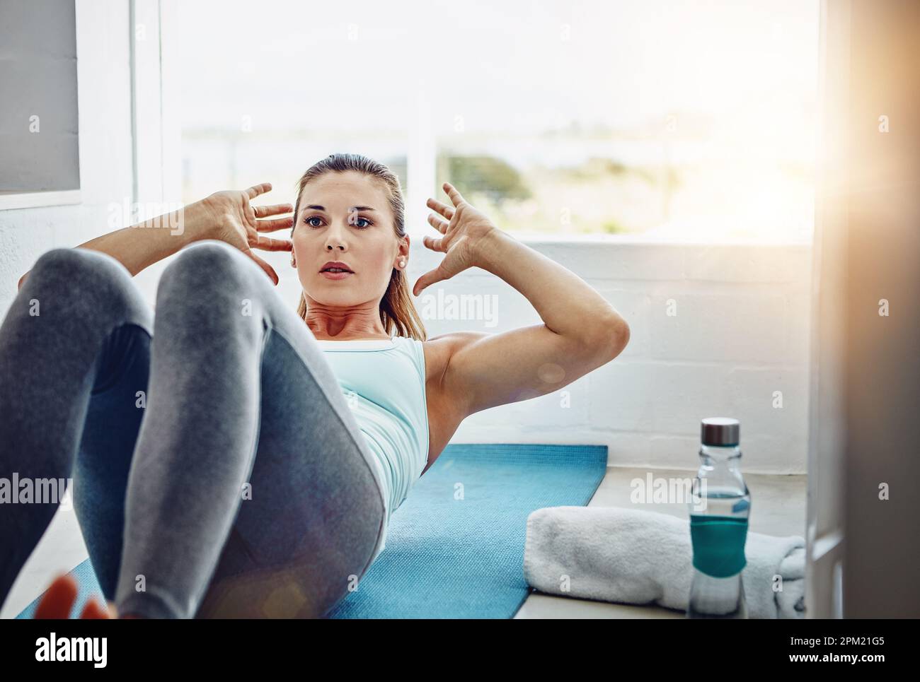 Always be a work in progress. a woman strengthening her core muscles ...