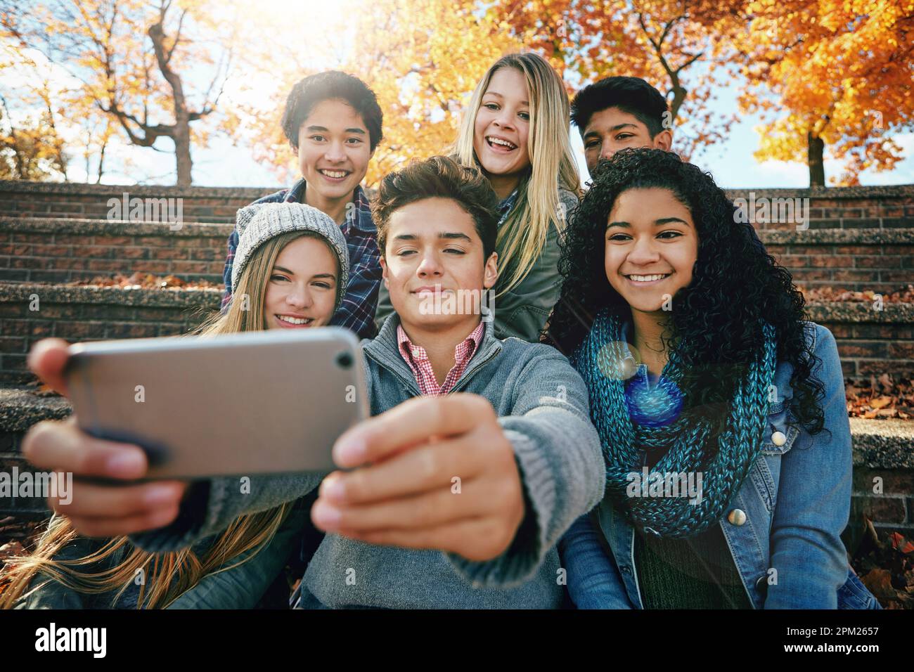 Just snapping a selfie. a group of young friends posing for a selfie ...